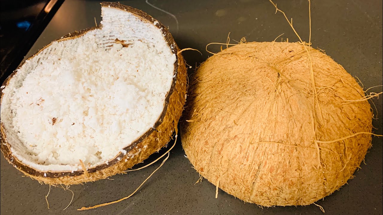 Grating A Coconut/ Using a kaguran😁 an old fashioned way.( Jocelyn's ...