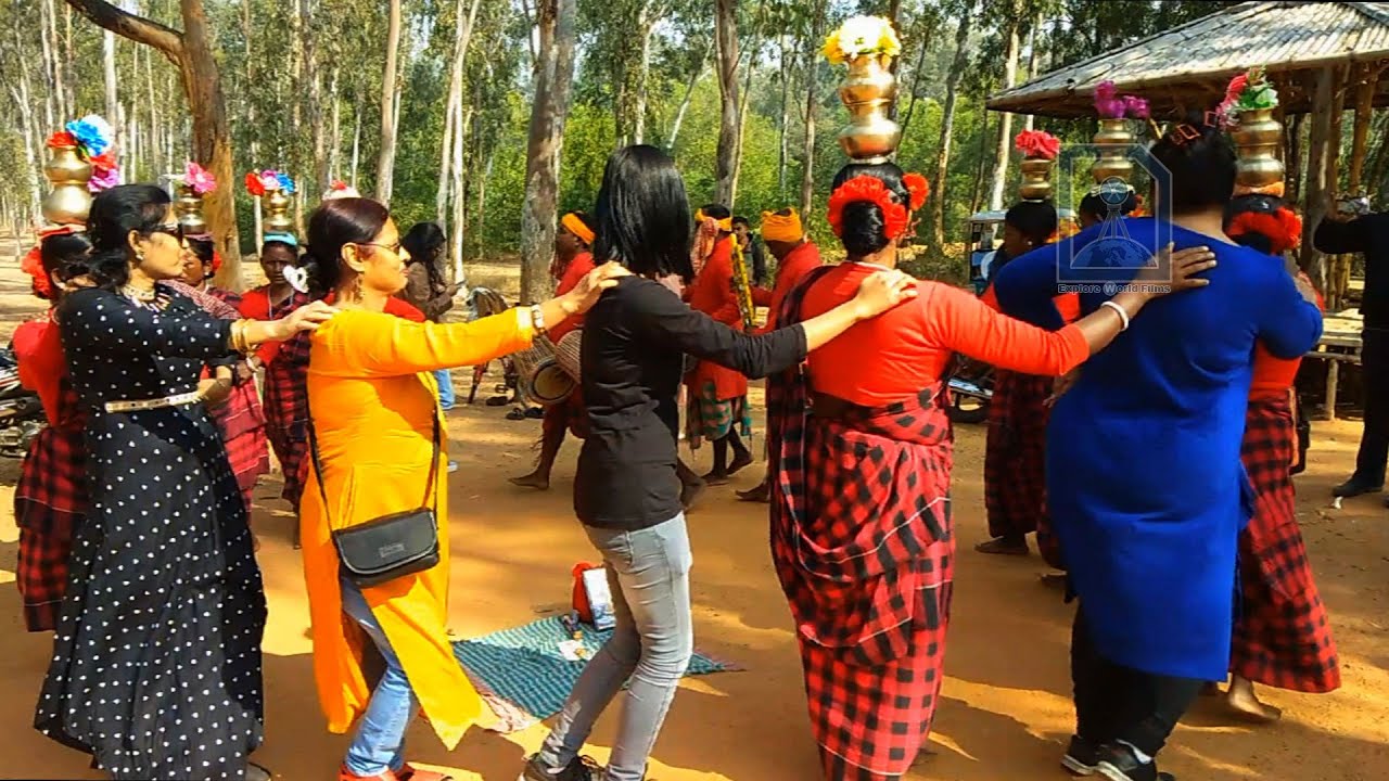 Tourists are dancing & singing with local traditional dressed Santali ...