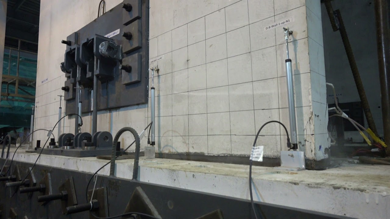 Low-damage concrete building earthquake test: Wall base with grouted ...