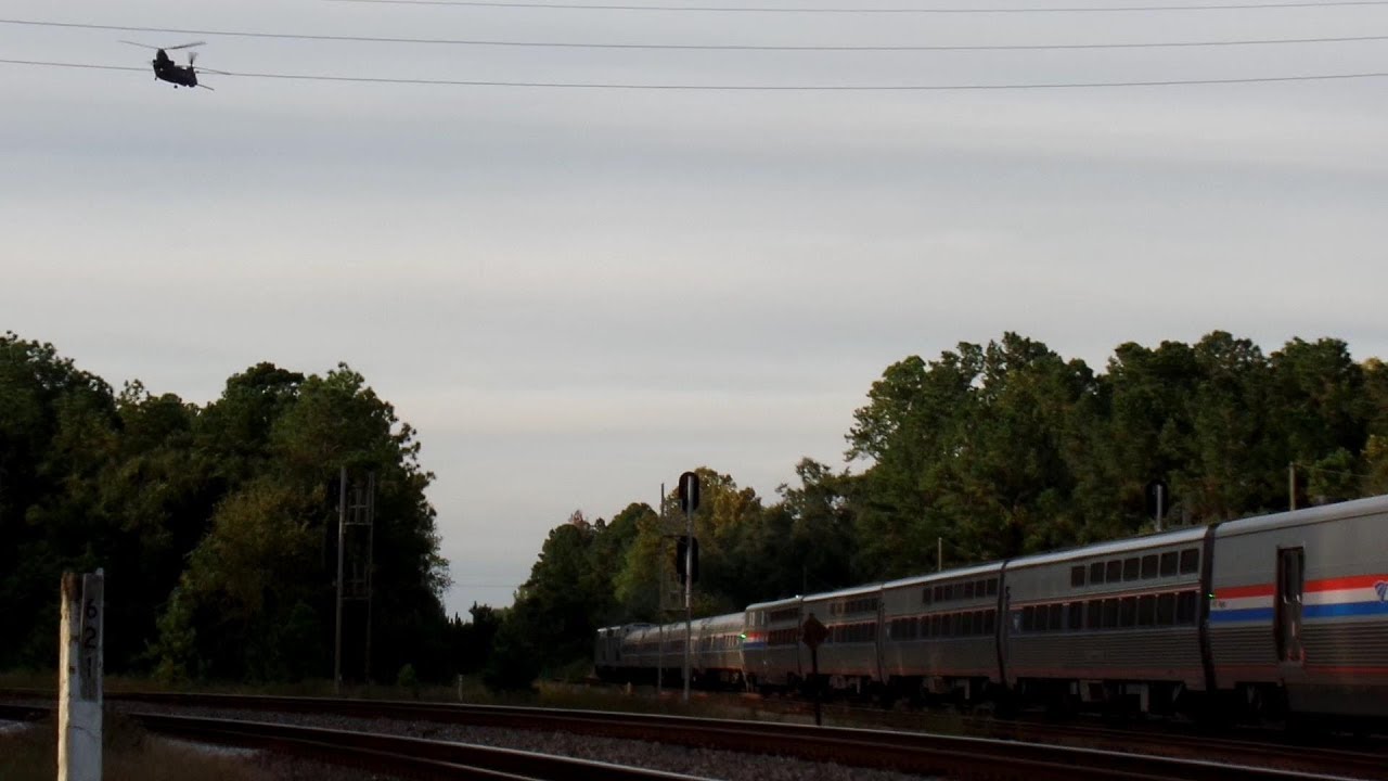 Military Helicopter Fly's Over Amtrak Train - YouTube