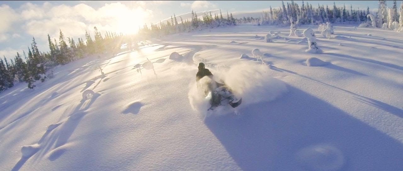 Beautiful snowmobile powder riding filmed with helicopter - YouTube