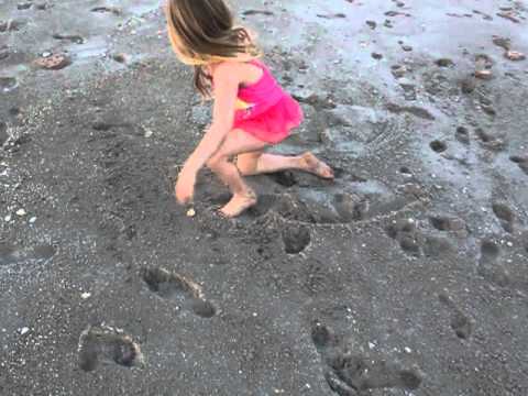 Claire Makes Sand Angels at the Florida Beach
