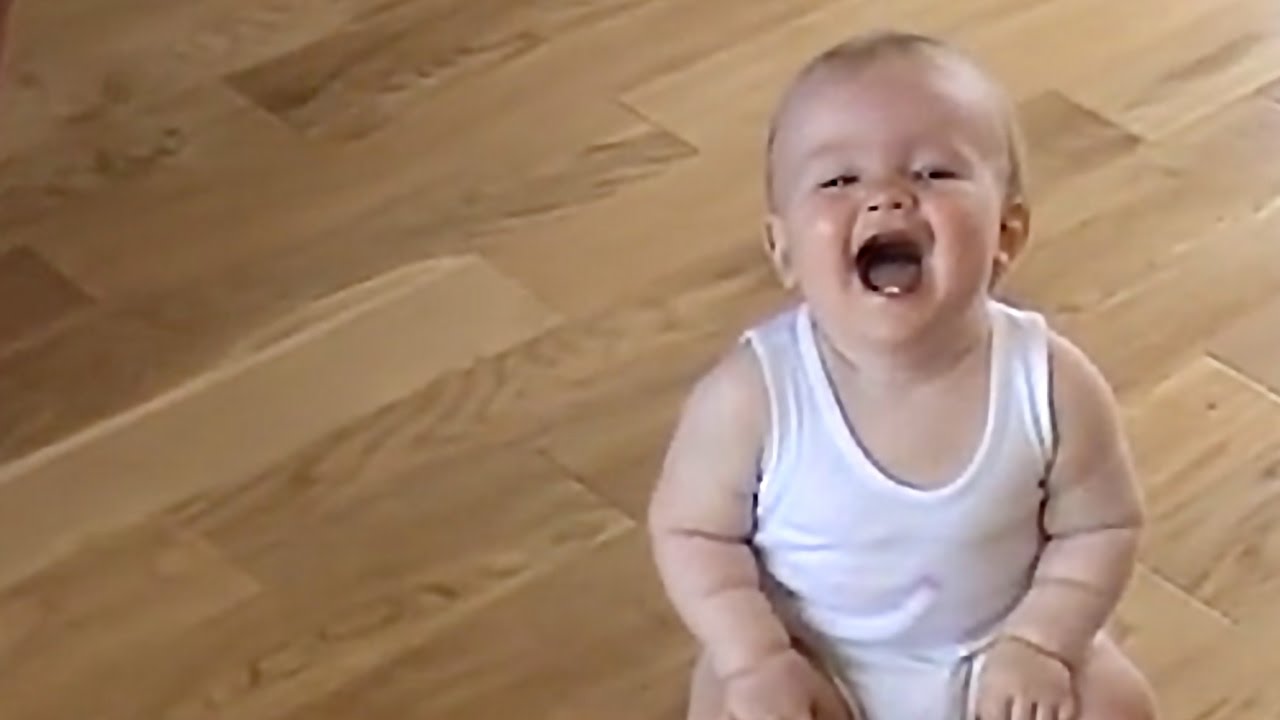 Baby laughing at squeaky trolley - YouTube