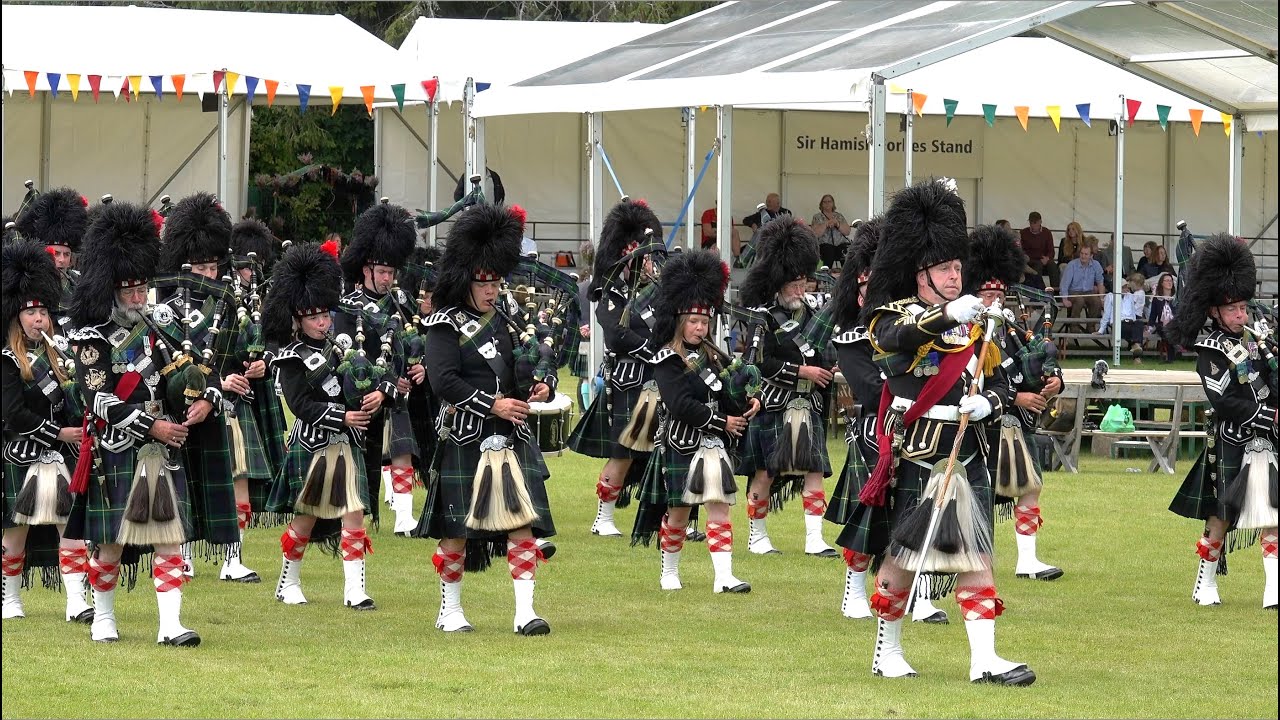 Lonach Pipe Band march and form playing circle during Beating Retreat ...