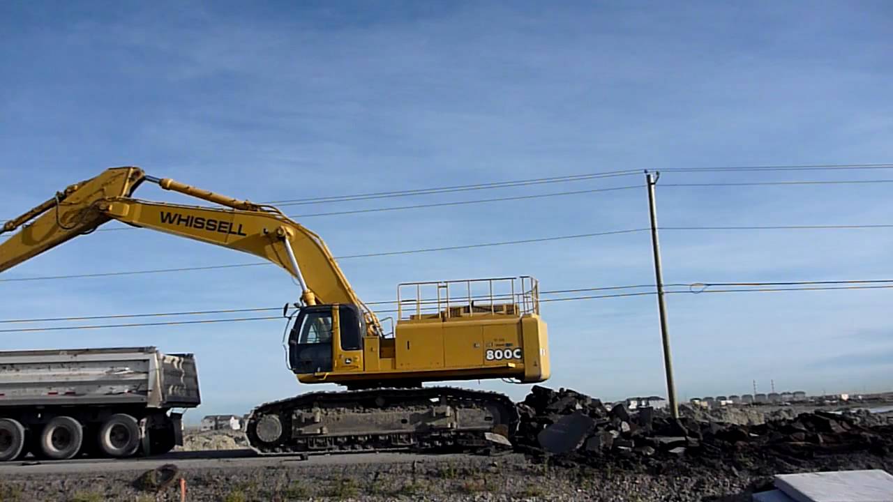 JD 800C Removing Pavement - YouTube