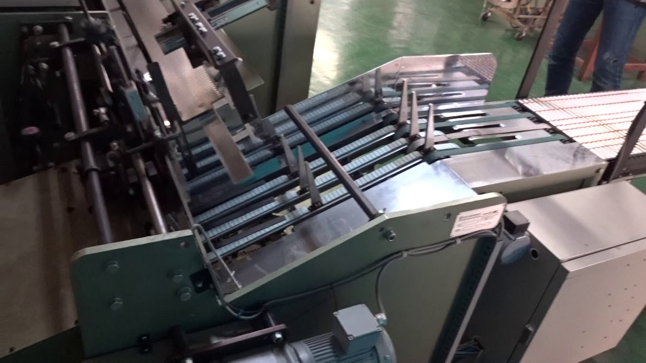 TSK GATHERING MACHINE OPTION SUN MACHINERY STACKER DERIVERY - YouTube