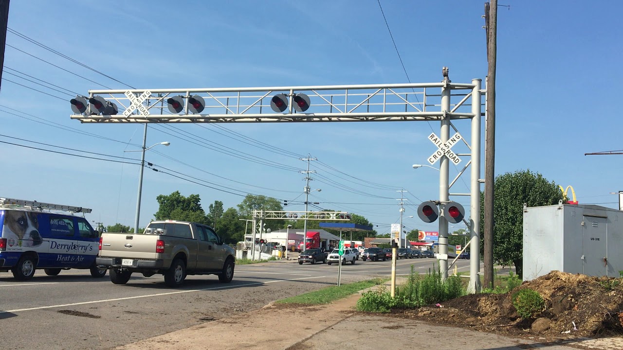 CSX 6060 Crosses Busy Railroad Crossing - YouTube