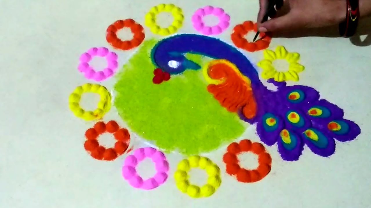 Peacock Rangoli Design*Beautiful Rangoli New Designs | Very simple ...