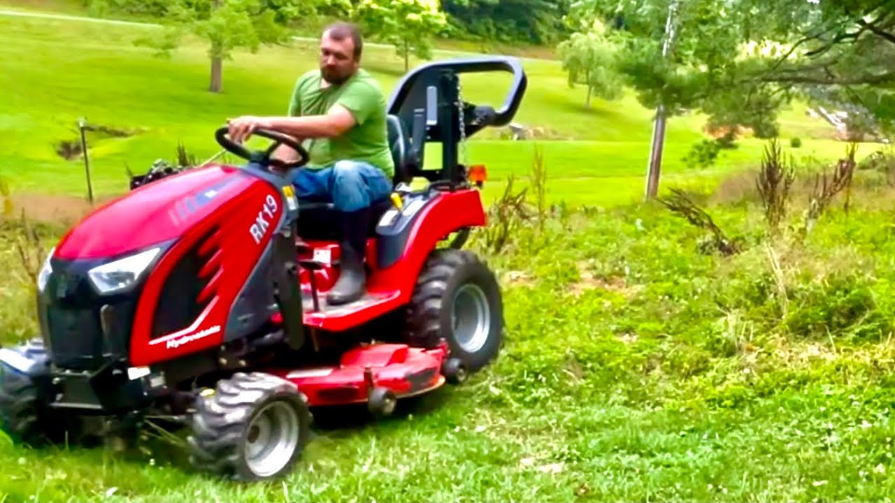Mowing an overgrown garden with my Rural King RK19 4wd tractor! - YouTube