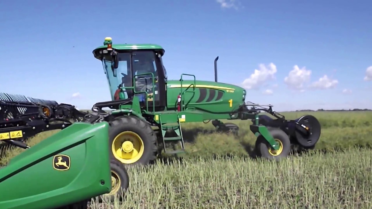John Deere W150 swather in Saskatchewan - YouTube