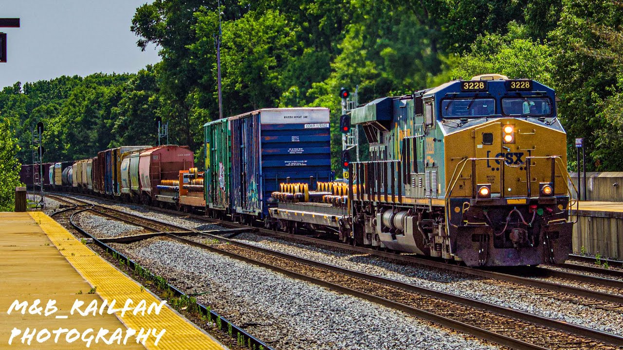 CSX M410-29 coming through greenbelt with some wheels and a rear DPU ...