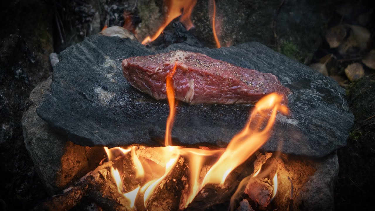Cooking a Steak on a Stone Primitive Style - YouTube