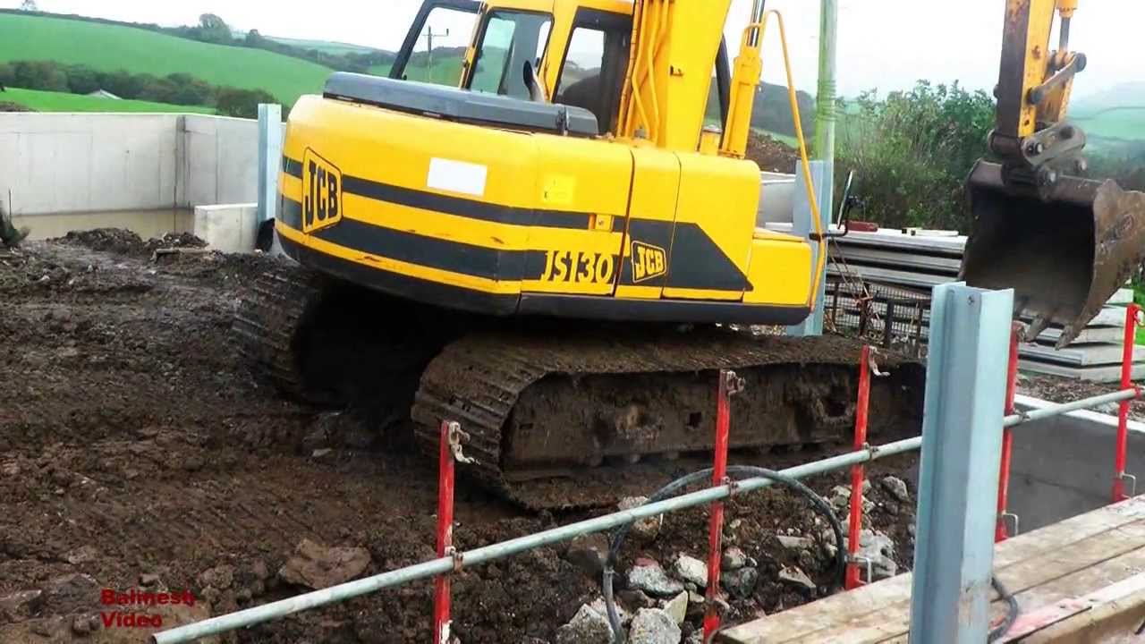 Waiting for the Concrete. Some Diggers in Action. Some Cattle Watch ...