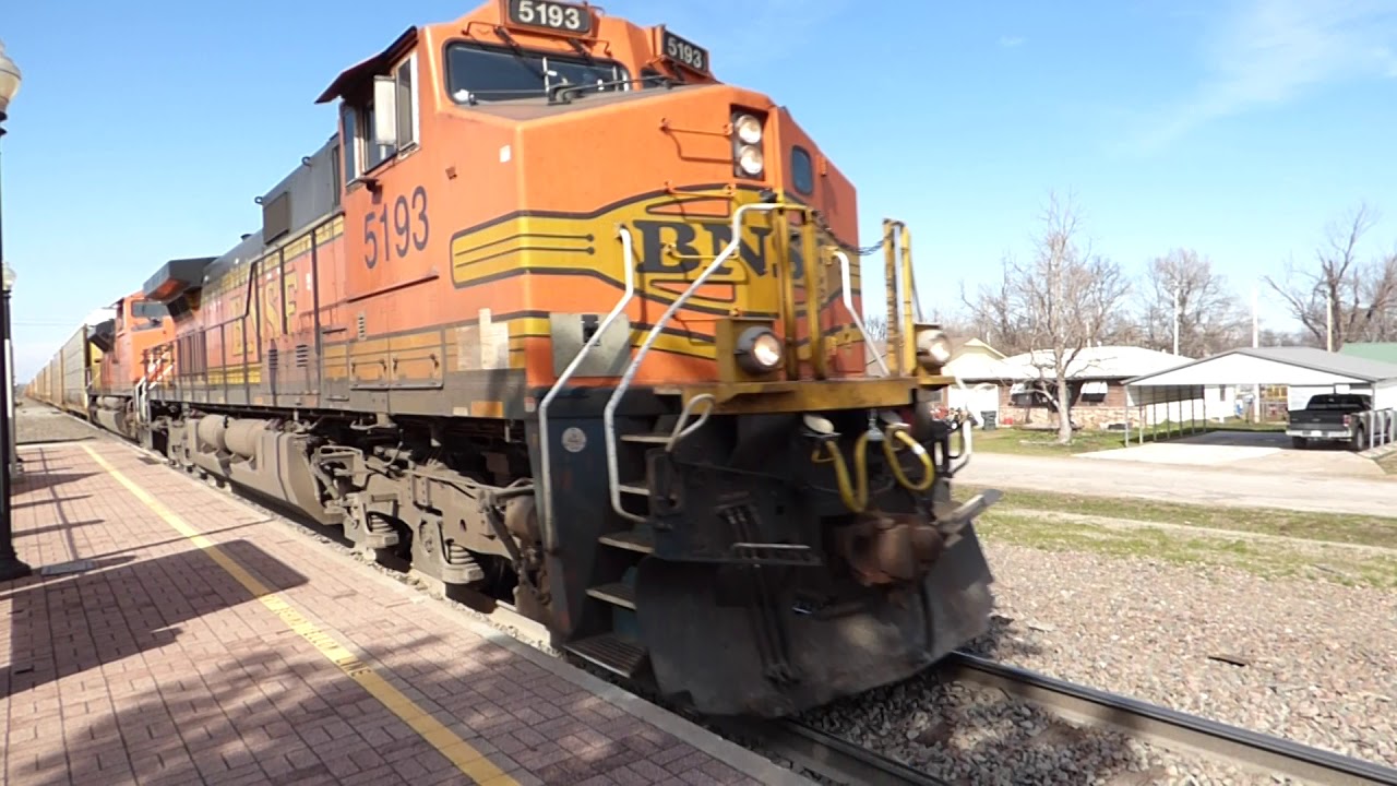 BNSF 5193 leads southbound auto rack train past the former ATSF depot ...