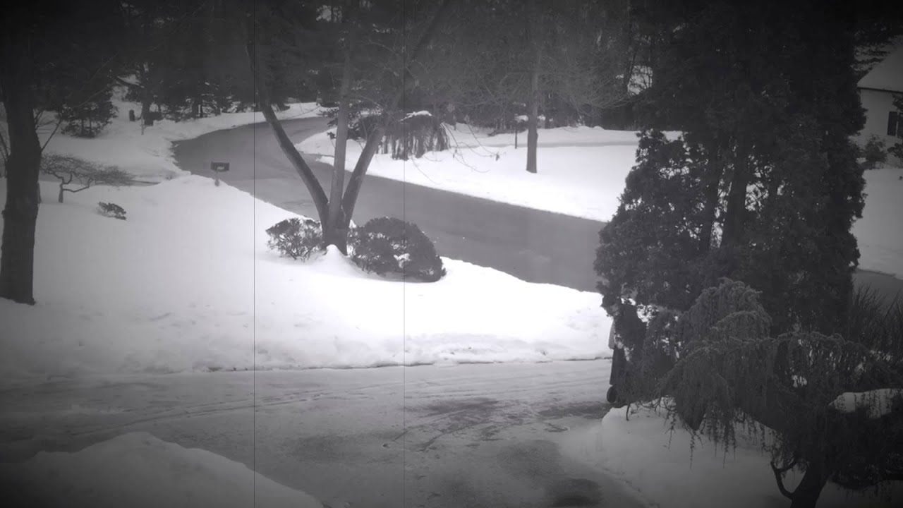 Man slides down frozen driveway chaplin style - YouTube