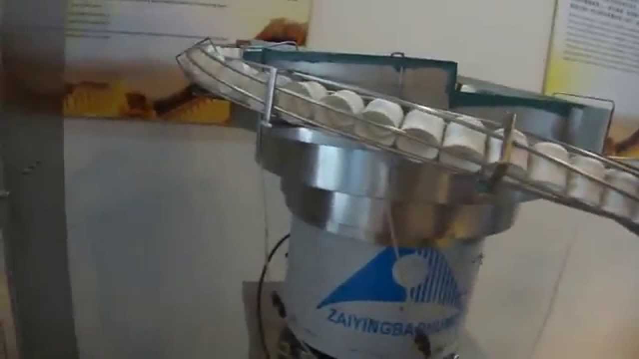 Cap feeding system for capping machine máquina que capsula - YouTube