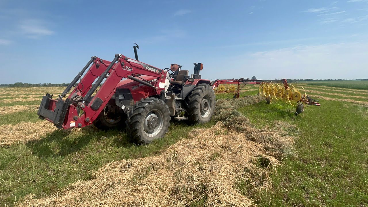 Raking half of first cutting - YouTube