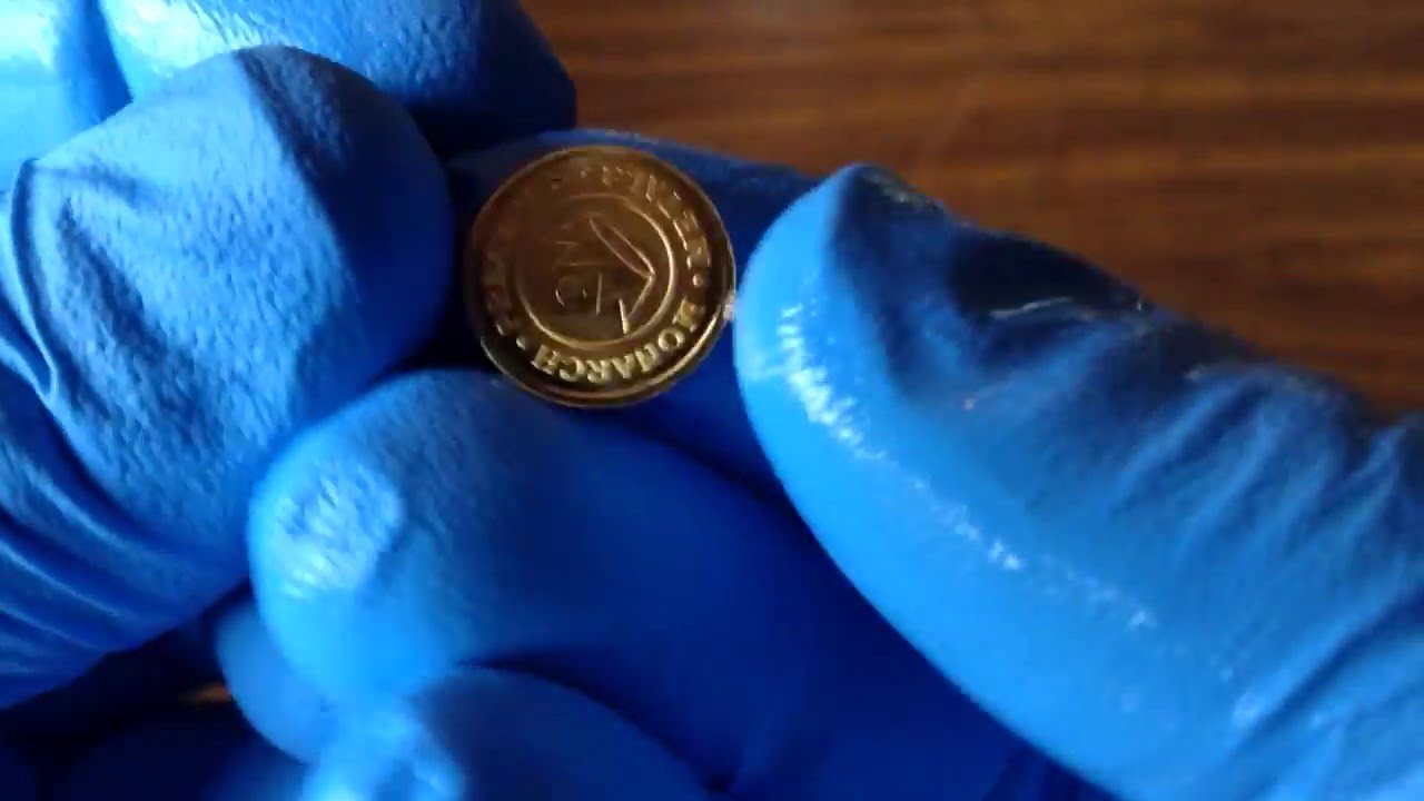 Cleaning copper spots from a gold round - YouTube