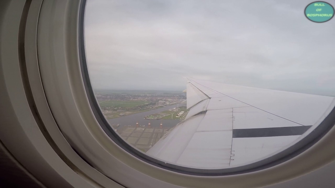 Boeing 777 Emirates * Amsterdam Schiphol airport landing * Wing view ...