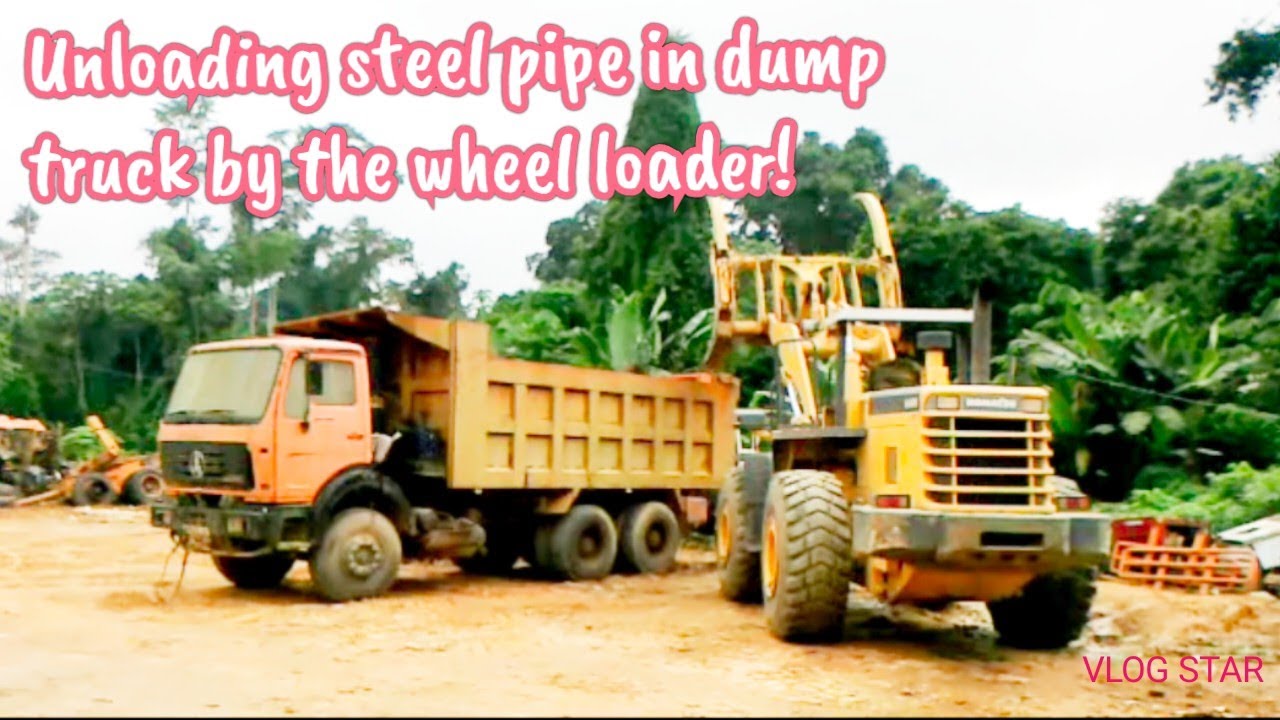 Unloading steel pipe in dump truck by the wheel loader! - YouTube