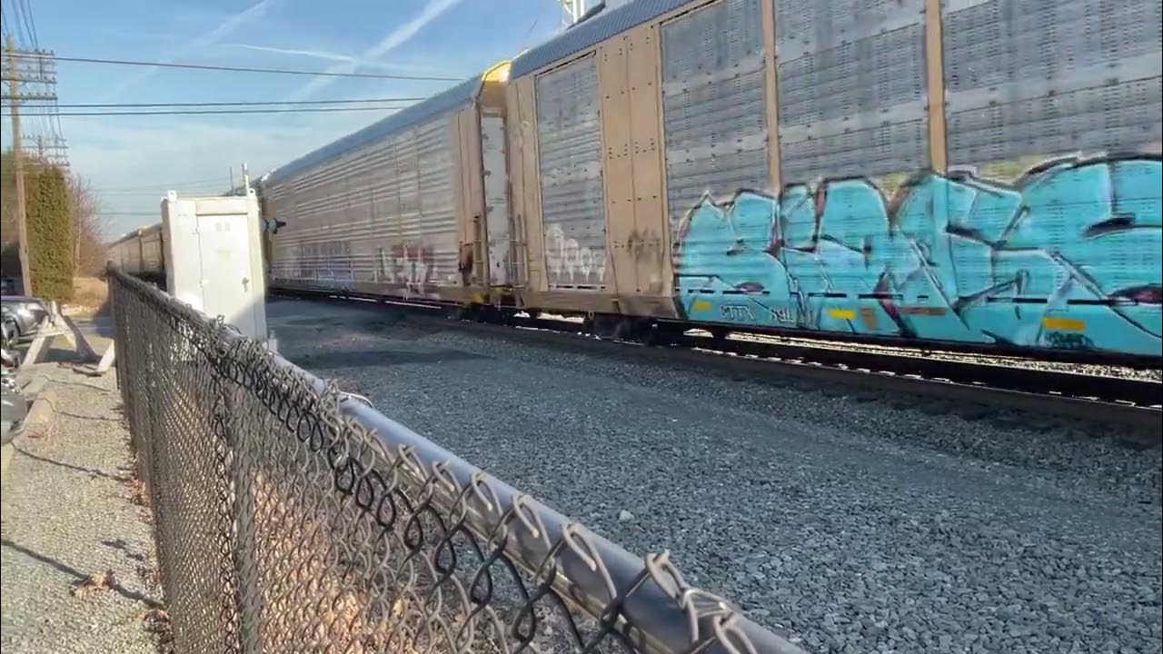 West bound ns 7534 followed by up 7611 auto rack train in sinking spring today - YouTube