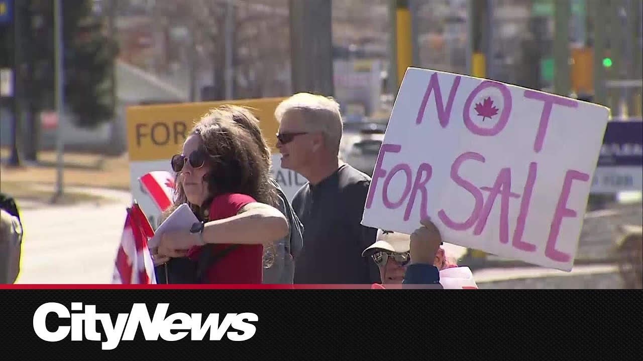 Rally held outside Tesla dealership in Calgary - YouTube