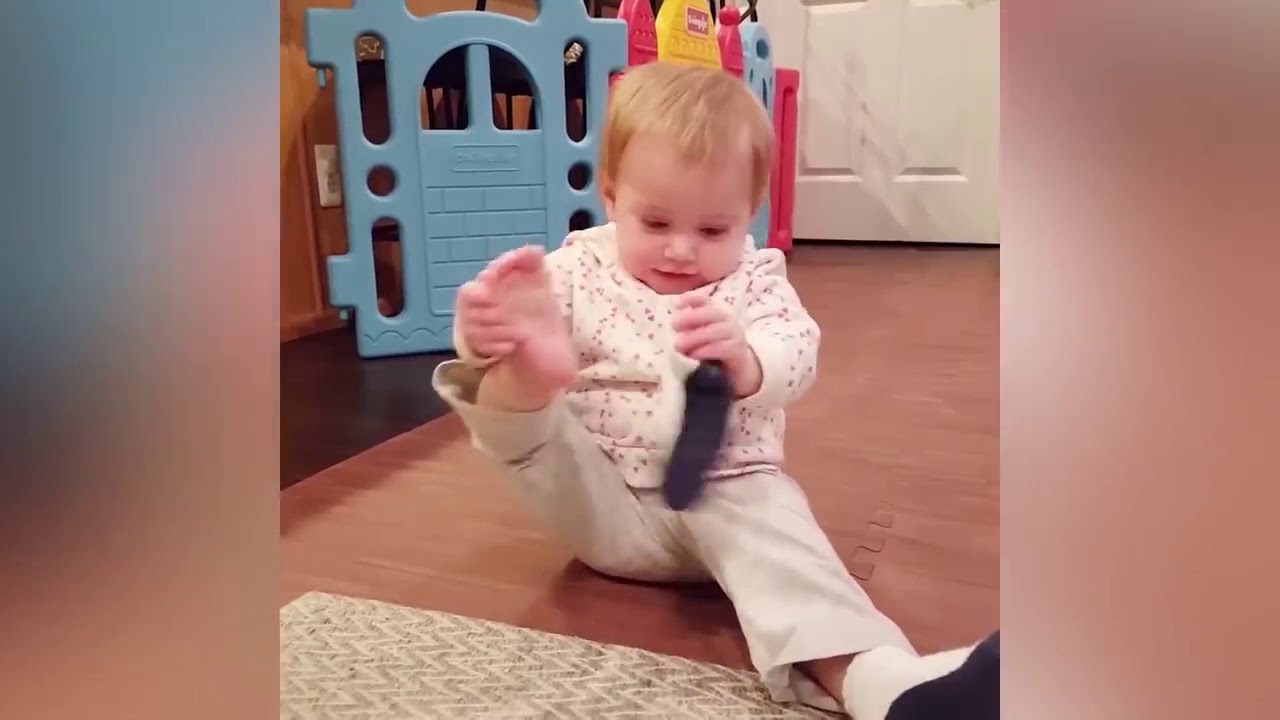 Baby wears socks by himself - funny video - YouTube