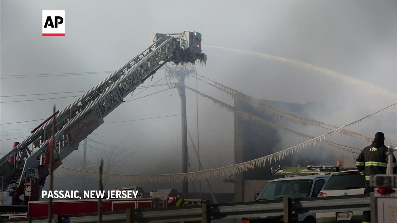 Crews battle flames in huge US recycling plant fire - YouTube