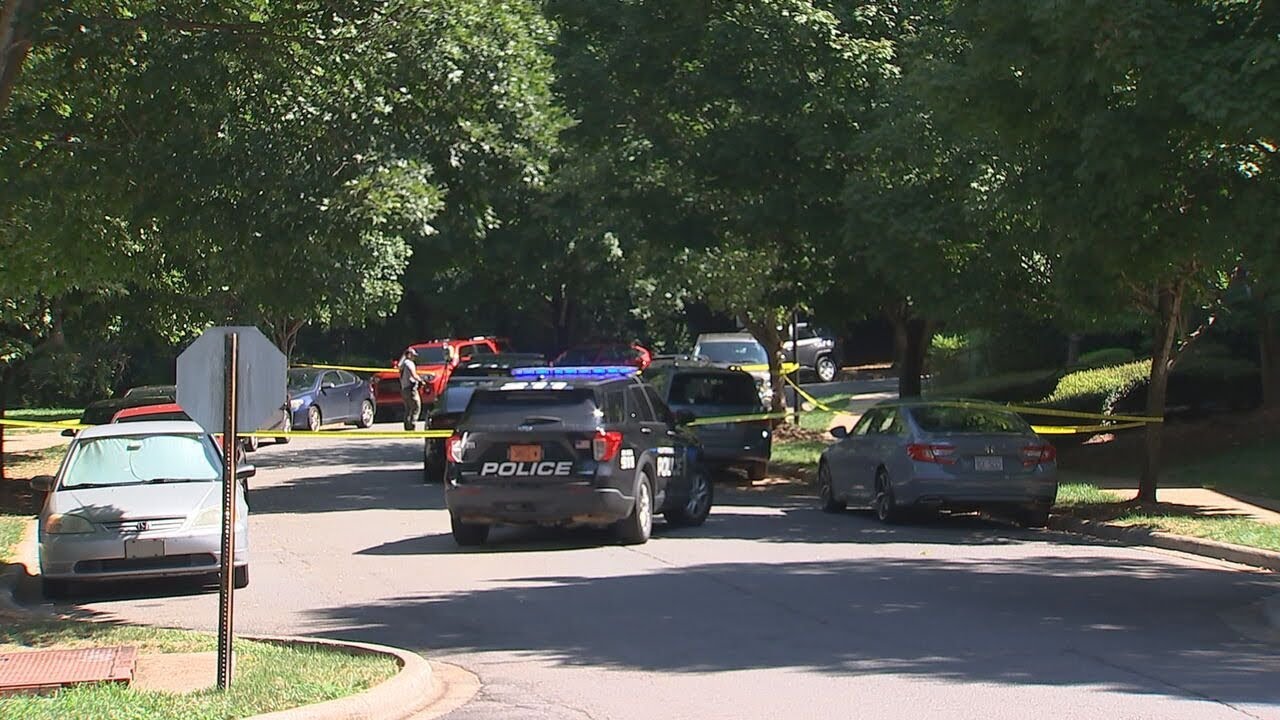 Woman shot after hitting officer with her car in Huntersville, police ...