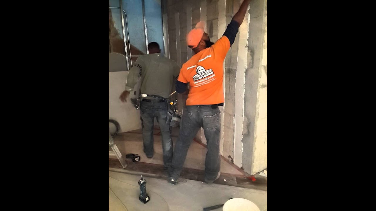 Laminating drywall to block wall - YouTube