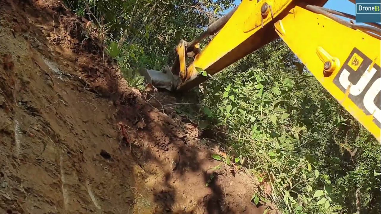 Landslide Blocked Hilly Road-Backhoe Loader-Removing Landslide Dirt ...