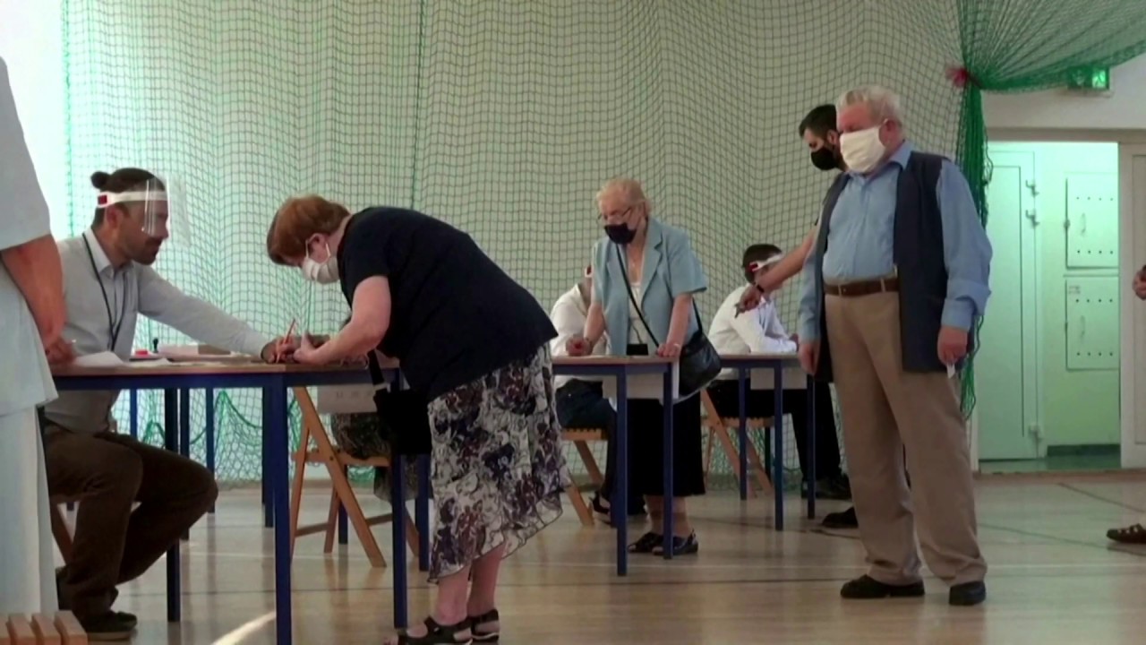 Poles stand in line for high-stakes presidential vote - YouTube