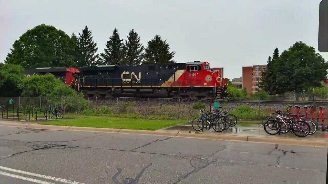 CN 3841 (with awful horn) leads CN M302 on the CN Flint Sub - YouTube