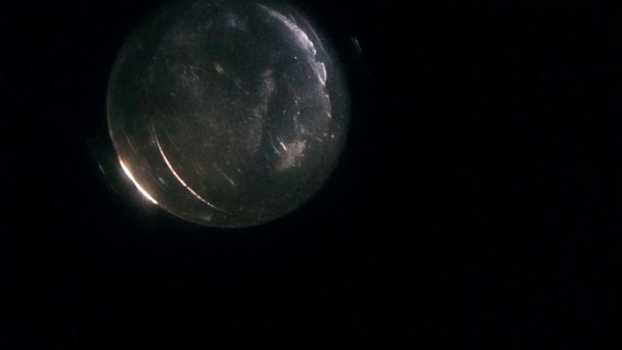 Moon magnified in glass - YouTube