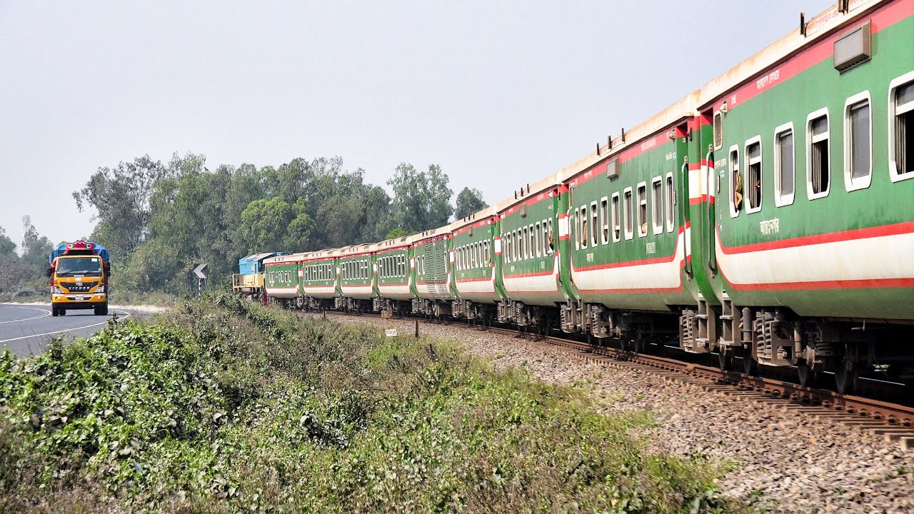Furious Rangpur Express Train passing through road side curve at BB ...