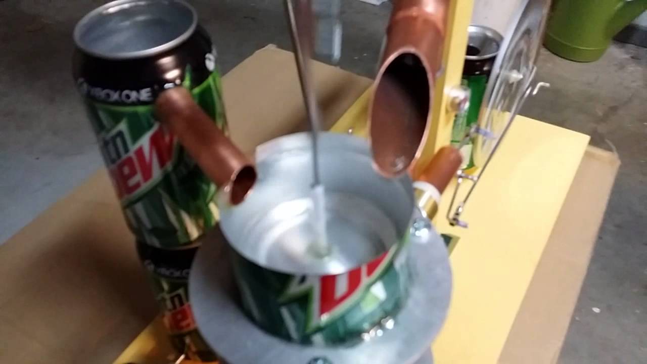 Stirling engine with water pump and lights - YouTube