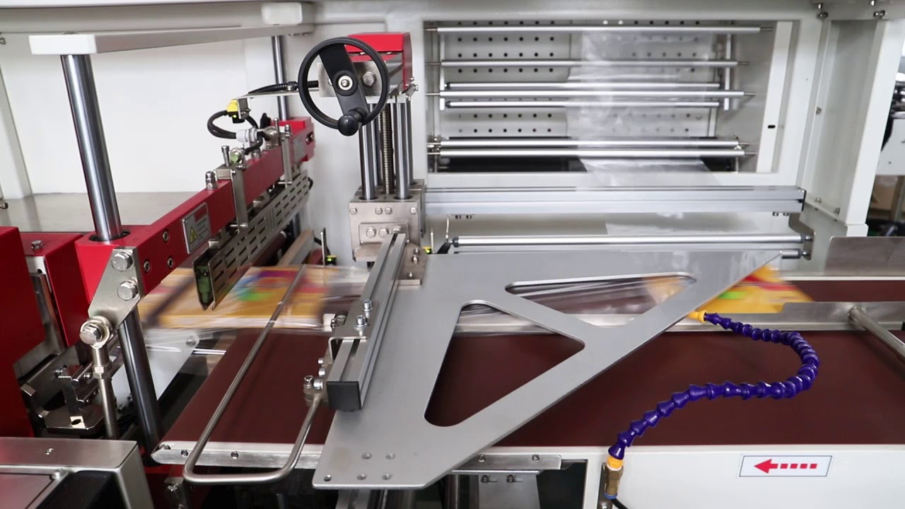 medium speed books shrink wrapping machine - YouTube