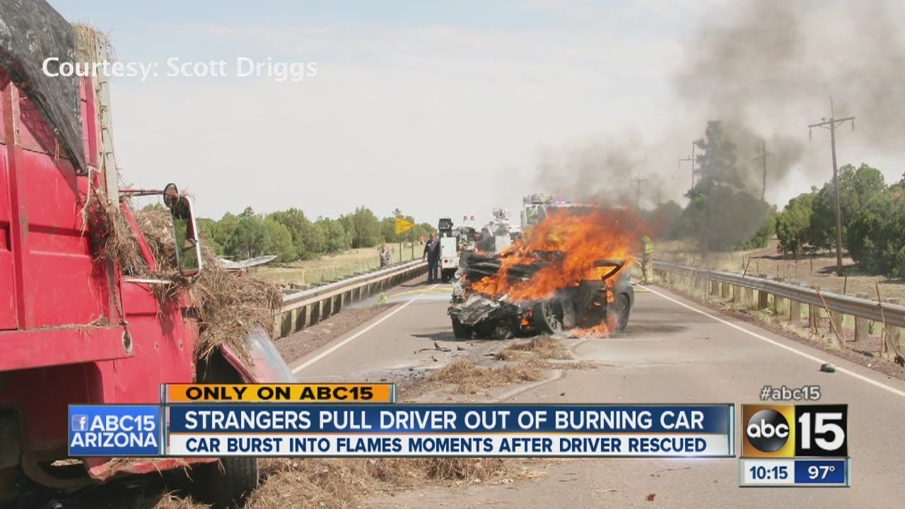 Strangers pull driver out of burning car - YouTube