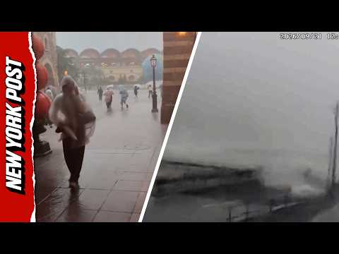 Typhoon Dujuan Wallops Eastern Japan as Residents Trudge Through Floodwaters to Safety