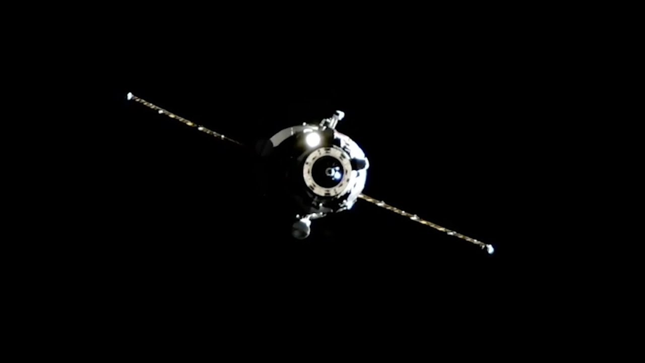 See a robotic Russian spaceship fly around and dock with space station ...