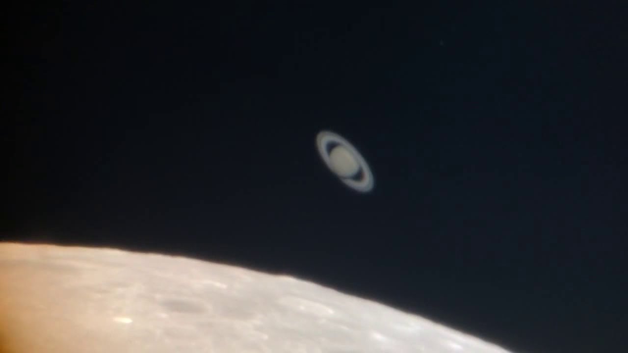 Saturn emerging after occultation from behind the Moon - YouTube