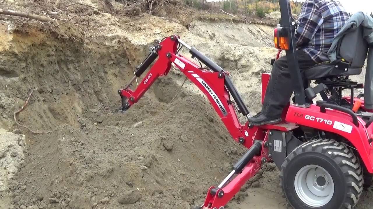 Massey Ferguson GC1710 digging in clay - YouTube