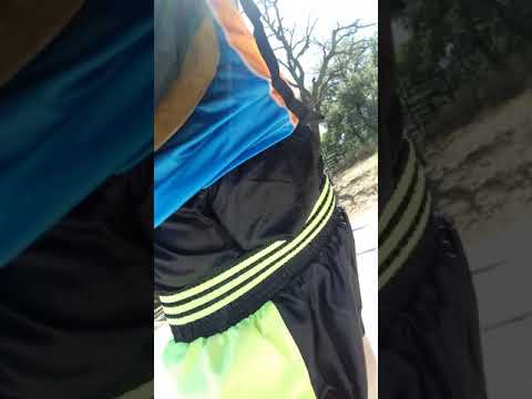 Sagging in shiny satin boxing shorts