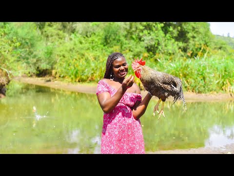 A LADY PREPARING CHICKEN FOR FOOD BAREFOOT