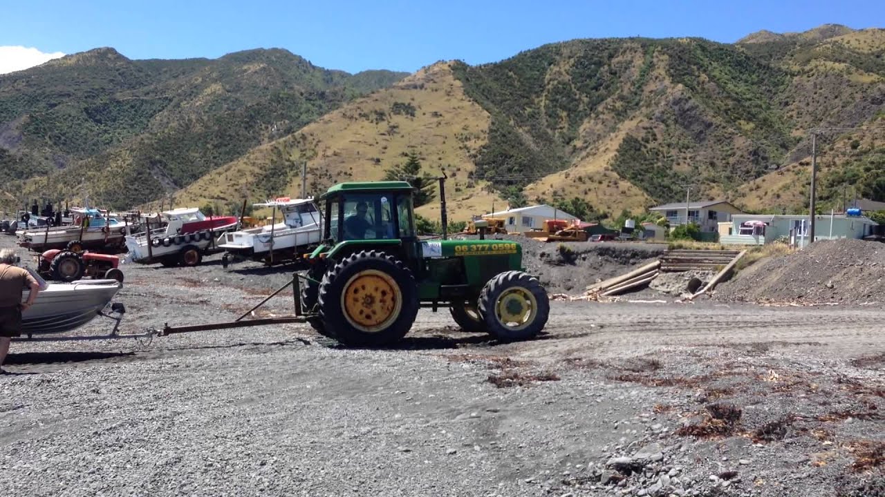 Brian driving tractor pulling boat out. - YouTube