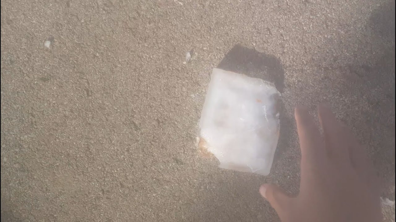 Throwing an ice cube a breaking it on camera - YouTube