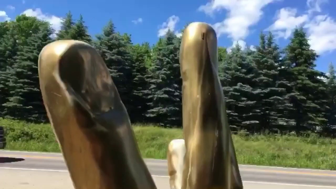 Giant gold hand on the side of the road....what does it mean?! - YouTube