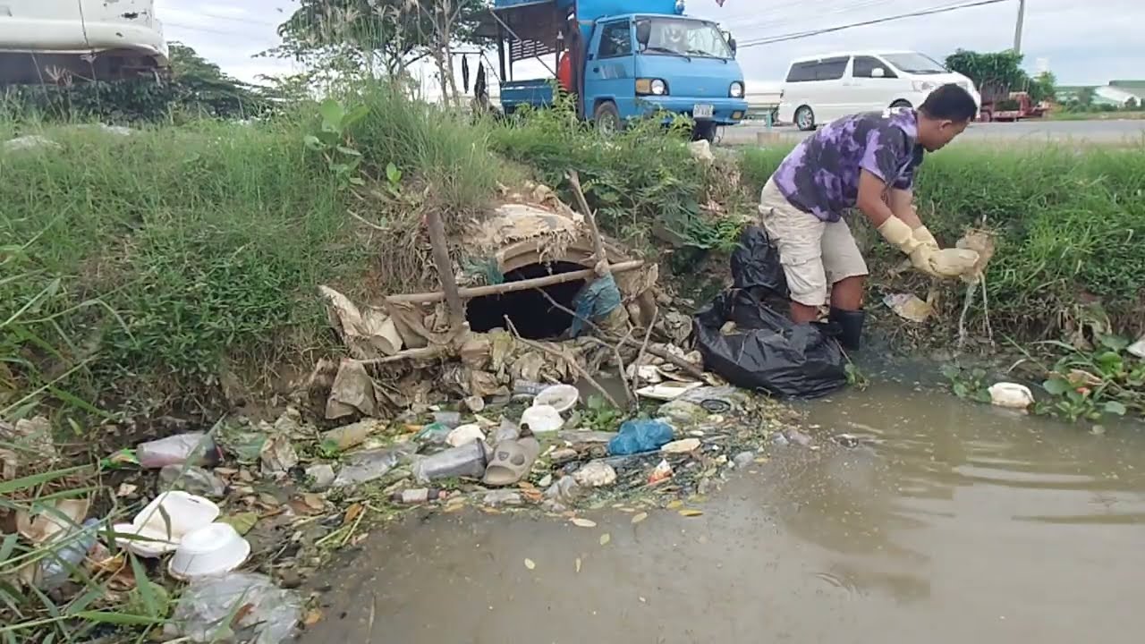 Fighting With Water Pollution From Plastic Trash Clogged Culvert Drain ...