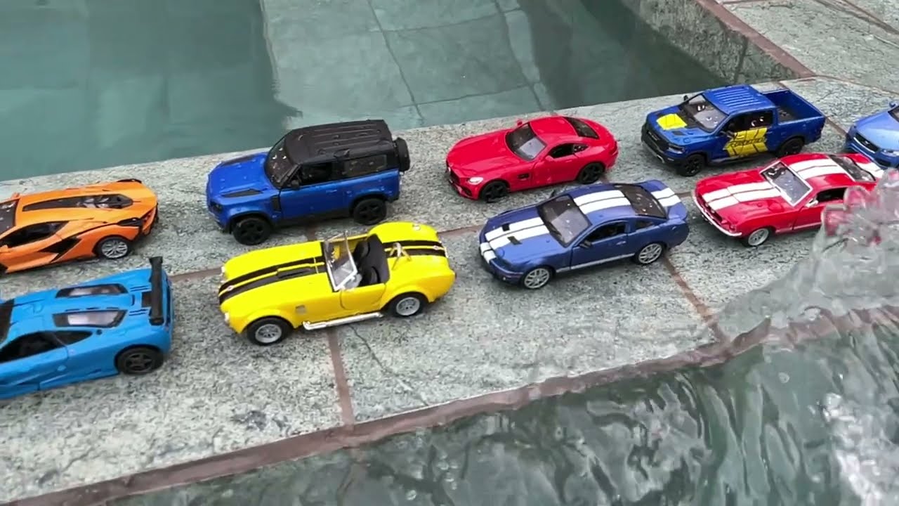 SMALL DIECAST CARS SLIDING OVER WATER IN SLOW MOTION - YouTube