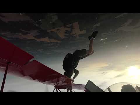 Doug Armer bi-plane exit at WTS - YouTube